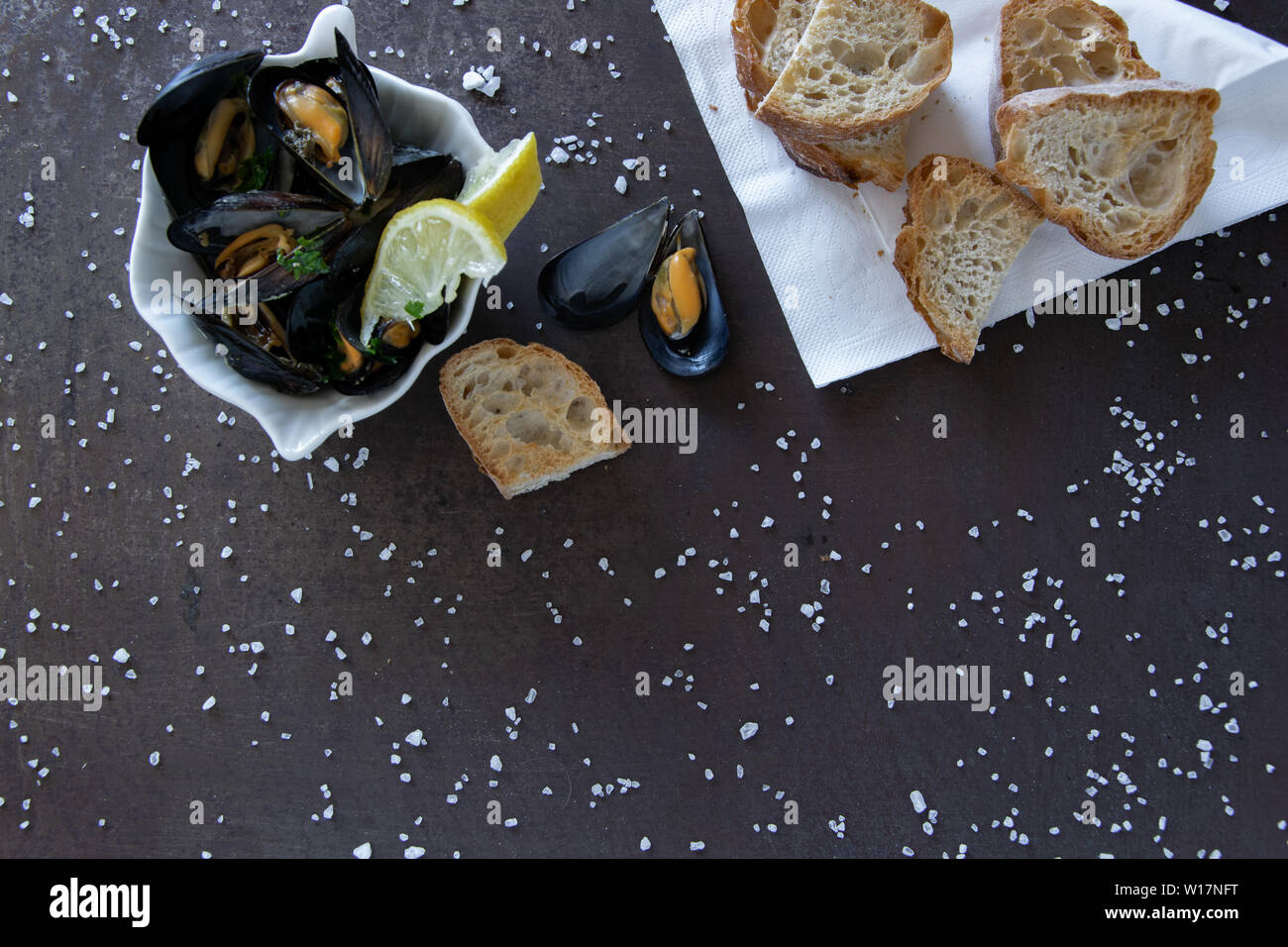 Cooked delicious black mussel with toasted bread. Healthy eating ...