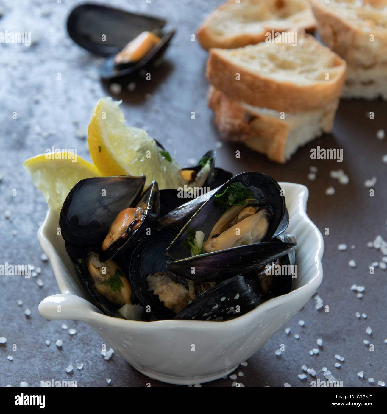 Cooked delicious black mussel with toasted bread. Healthy eating ...