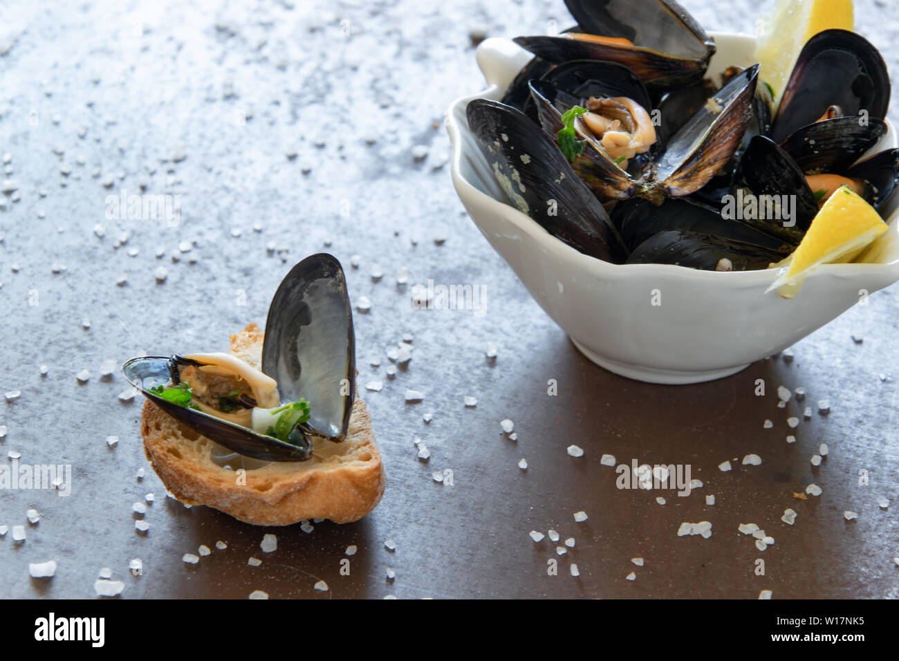 Cooked delicious black mussel with toasted bread. Healthy eating ...