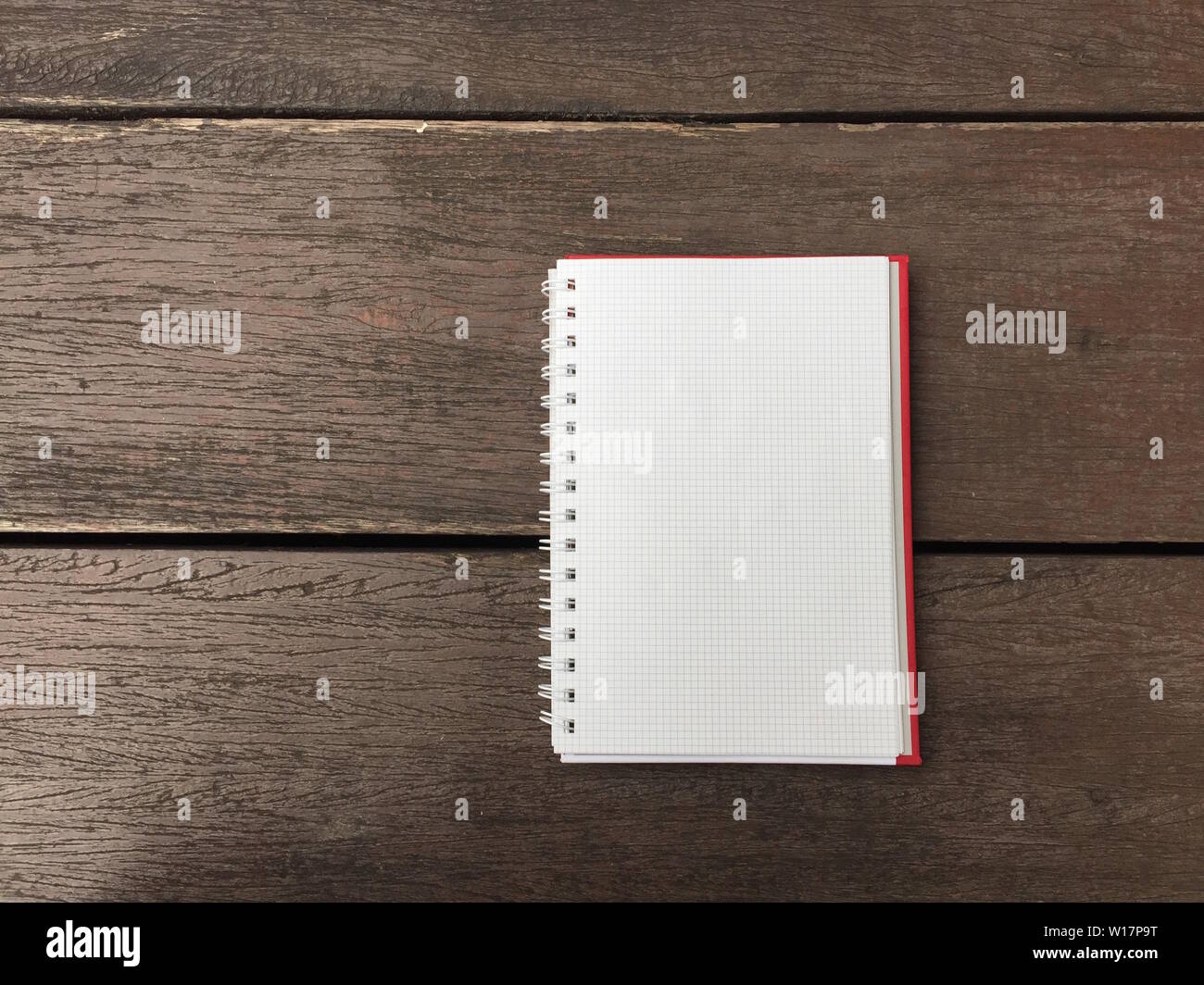 Notebook page on old wood table background with copy space. Blank open ...