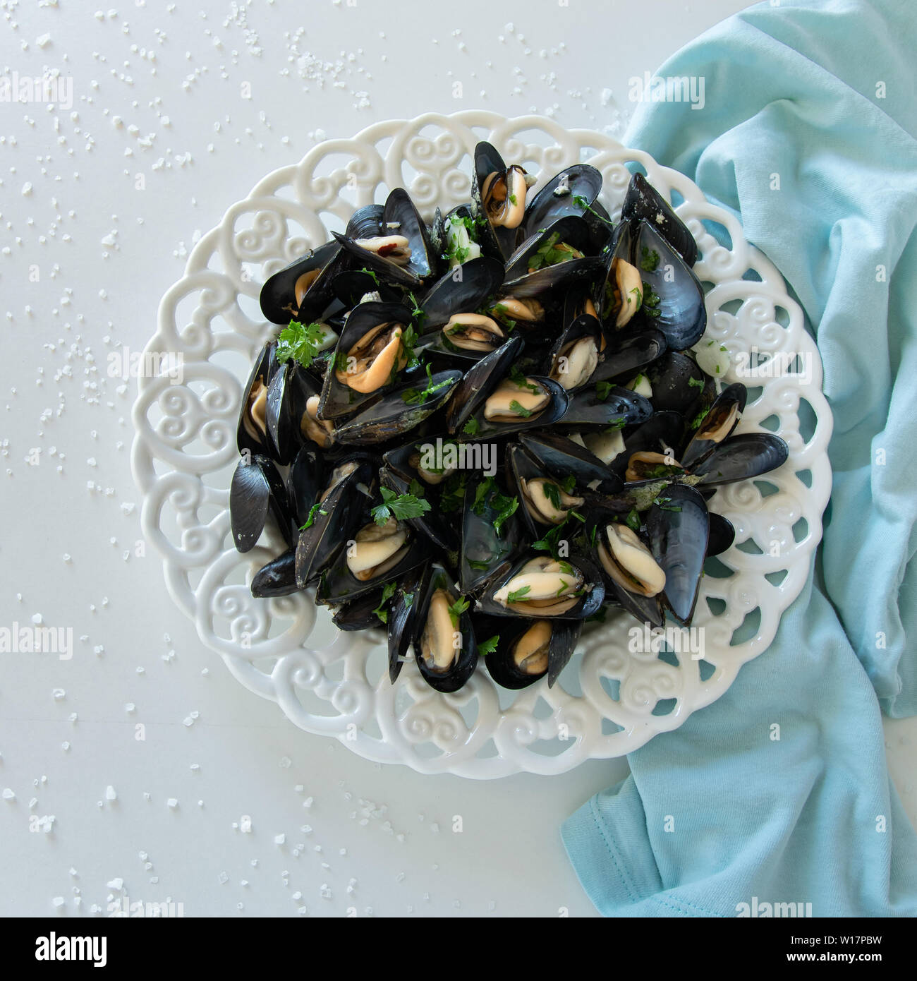 Cooked delicious black mussel, salty white background. Healthy eating ...