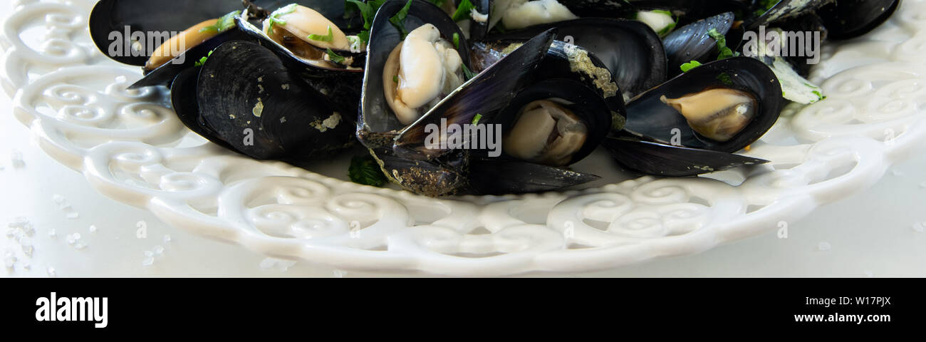 Close up view of cooked delicious black mussel. Healthy eating concept ...