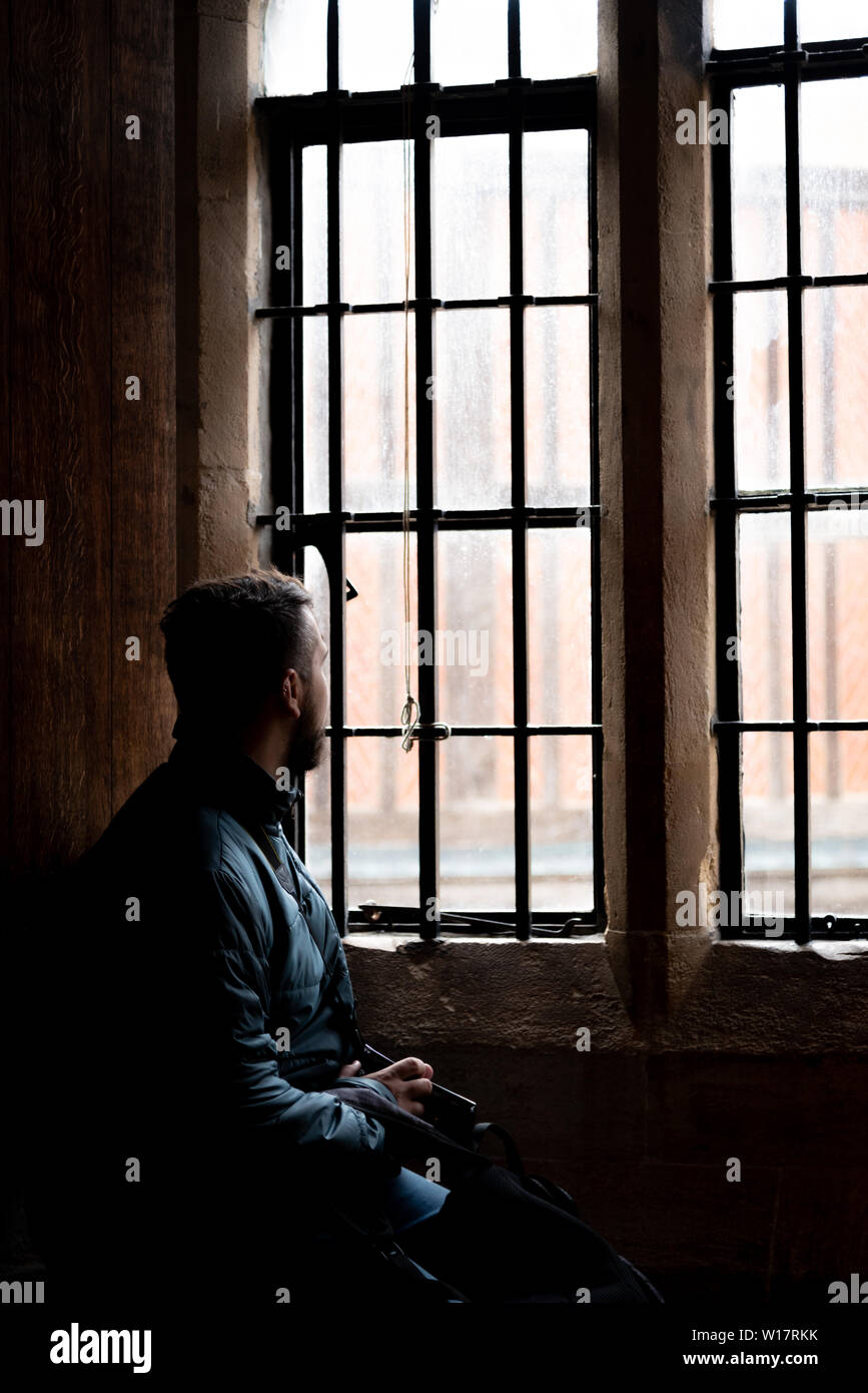 Staring at window silhouette hi-res stock photography and images - Alamy