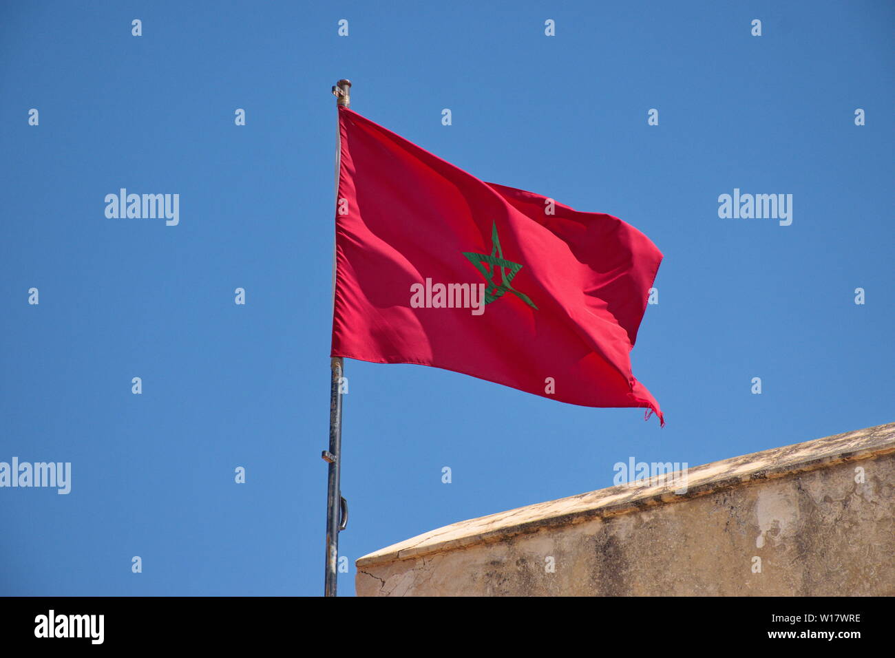 The flag of Morocco flies in the wind Stock Photo - Alamy