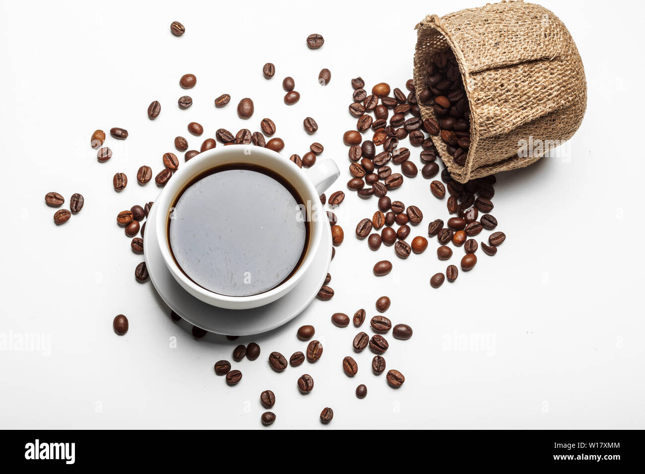 Coffee cup and beans on a white background Stock Photo - Alamy