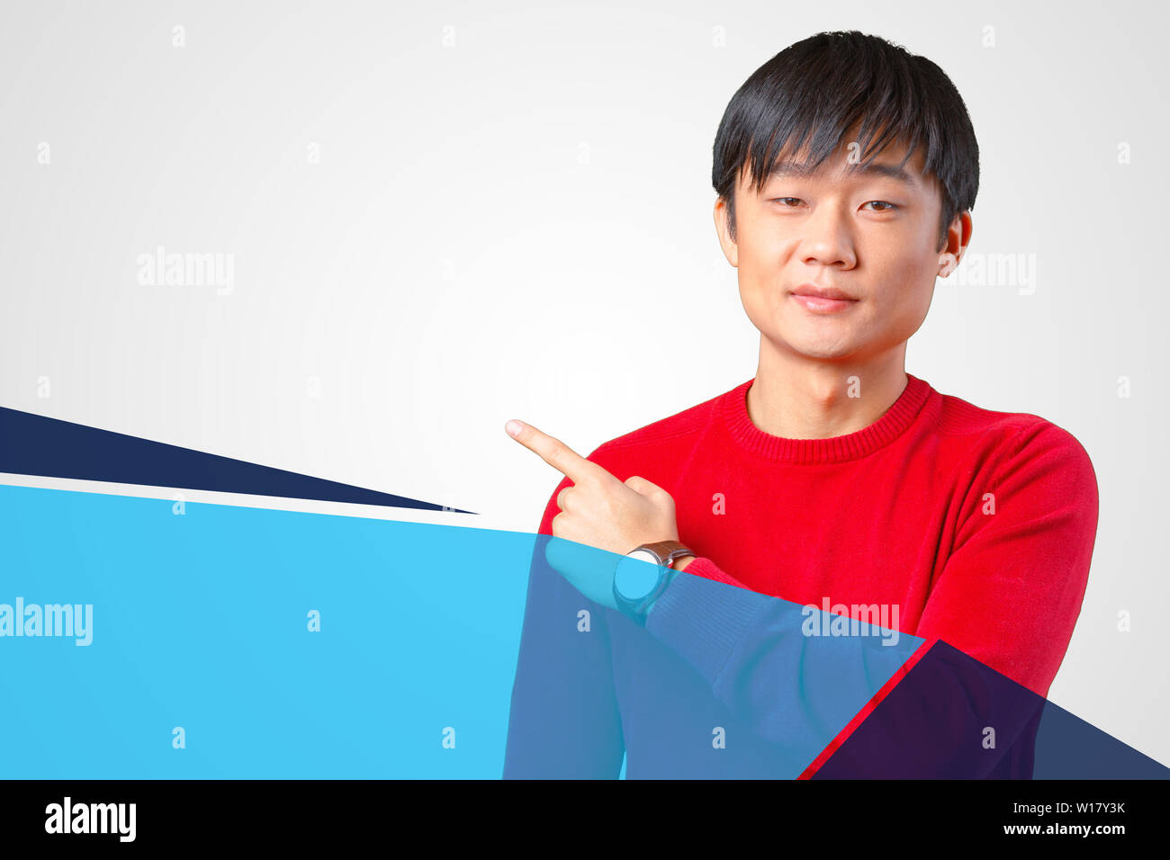 portrait of young asian man pointing with his finger Stock Photo - Alamy