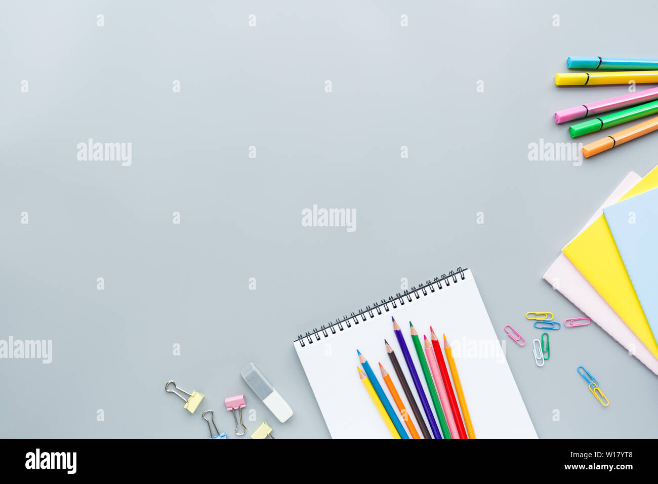 Orange back to school flat lay with bright stationery. School supplies ...
