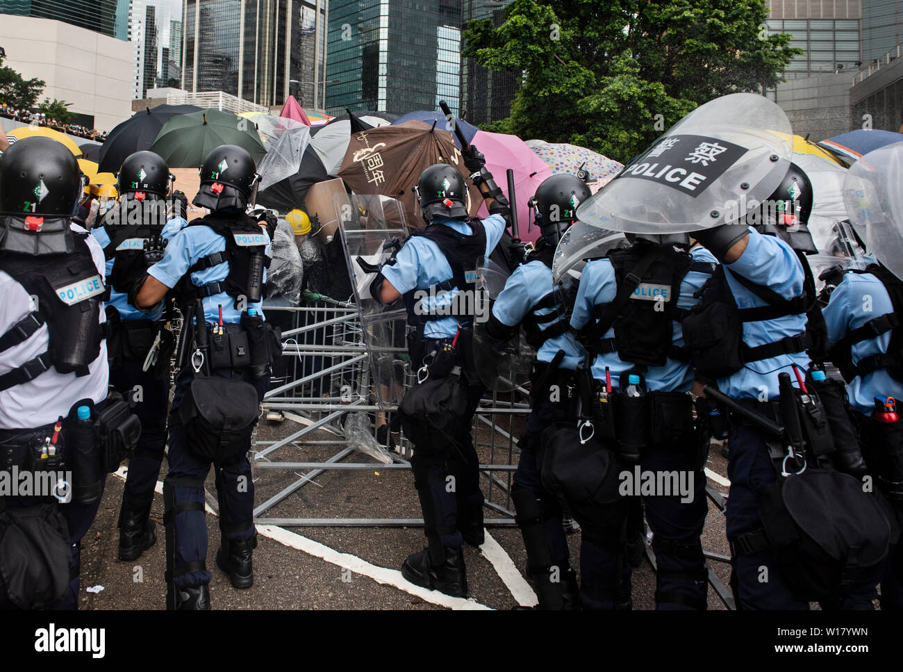 Police officer hits protesters with his baton. Thousands of anti ...