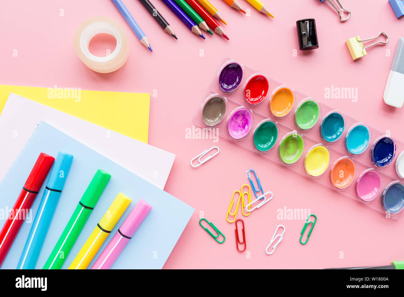 Orange back to school flat lay with bright stationery. School supplies ...