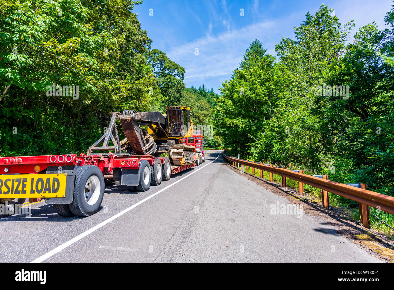 Big rig powerful heavy-duty semi truck tractor transporting oversized ...