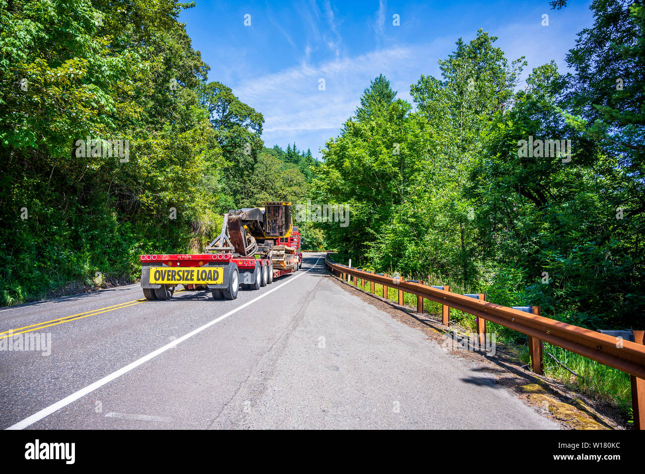 Big rig powerful heavy-duty semi truck tractor transporting oversized ...