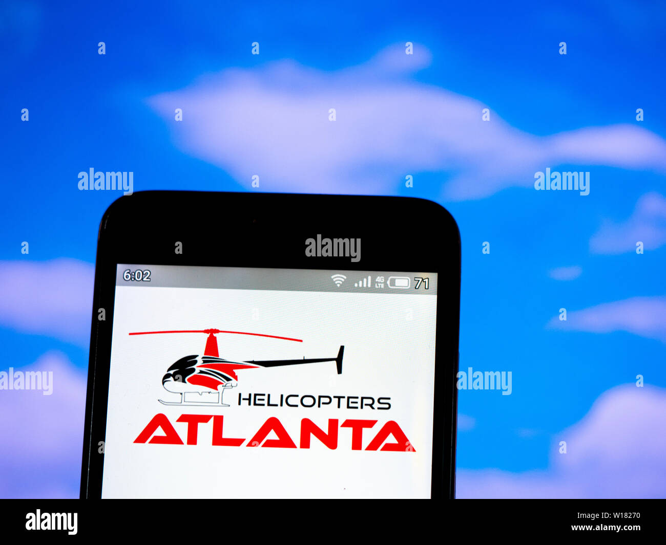 In this photo illustration the Atlanta Helicopters LLC logo is seen ...