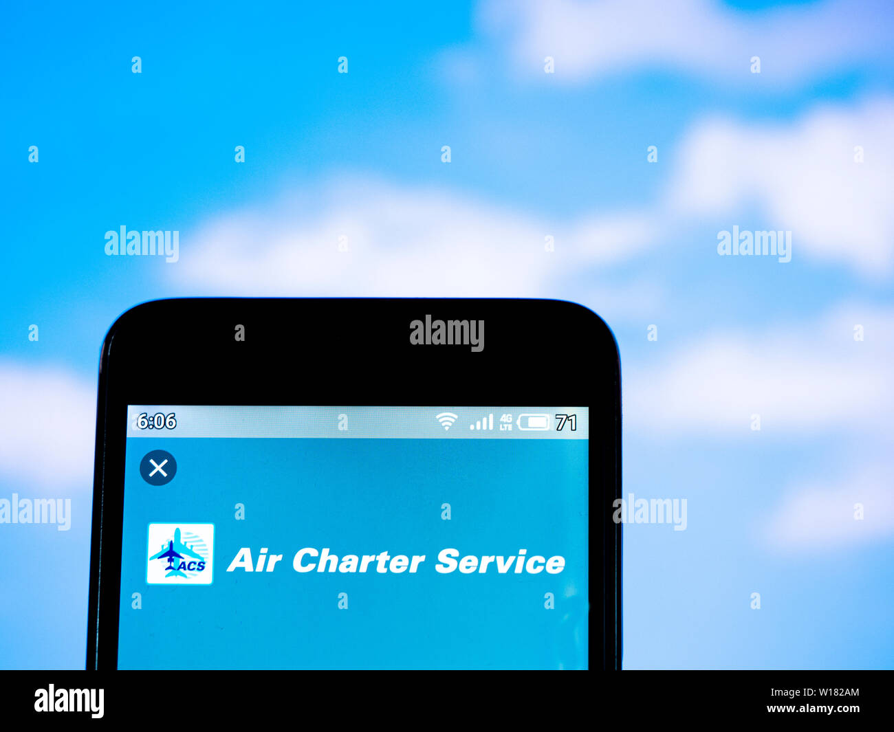 In this photo illustration the Air Charter Service logo is seen ...