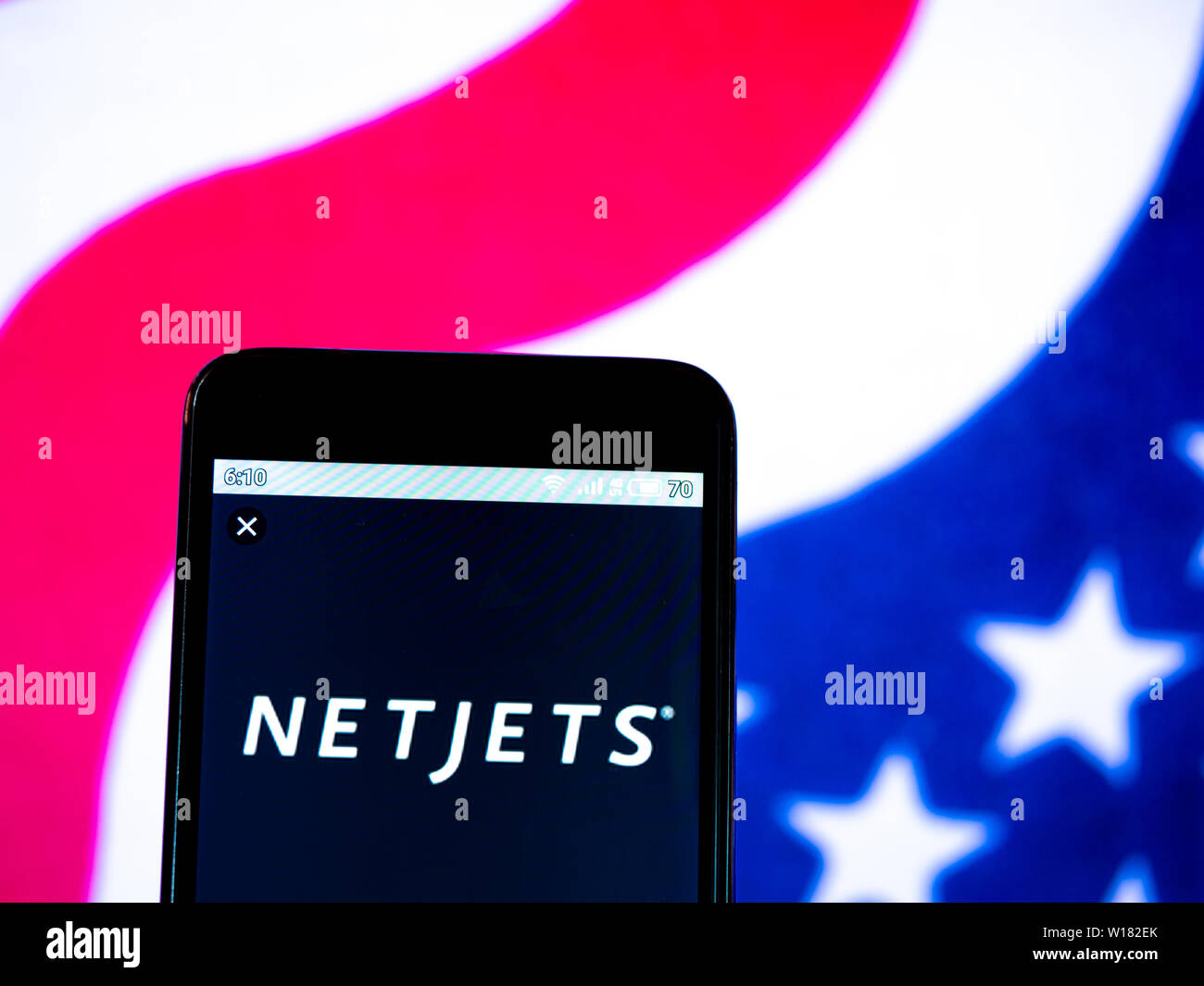 In this photo illustration the NetJets Inc. logo is seen displayed on a ...