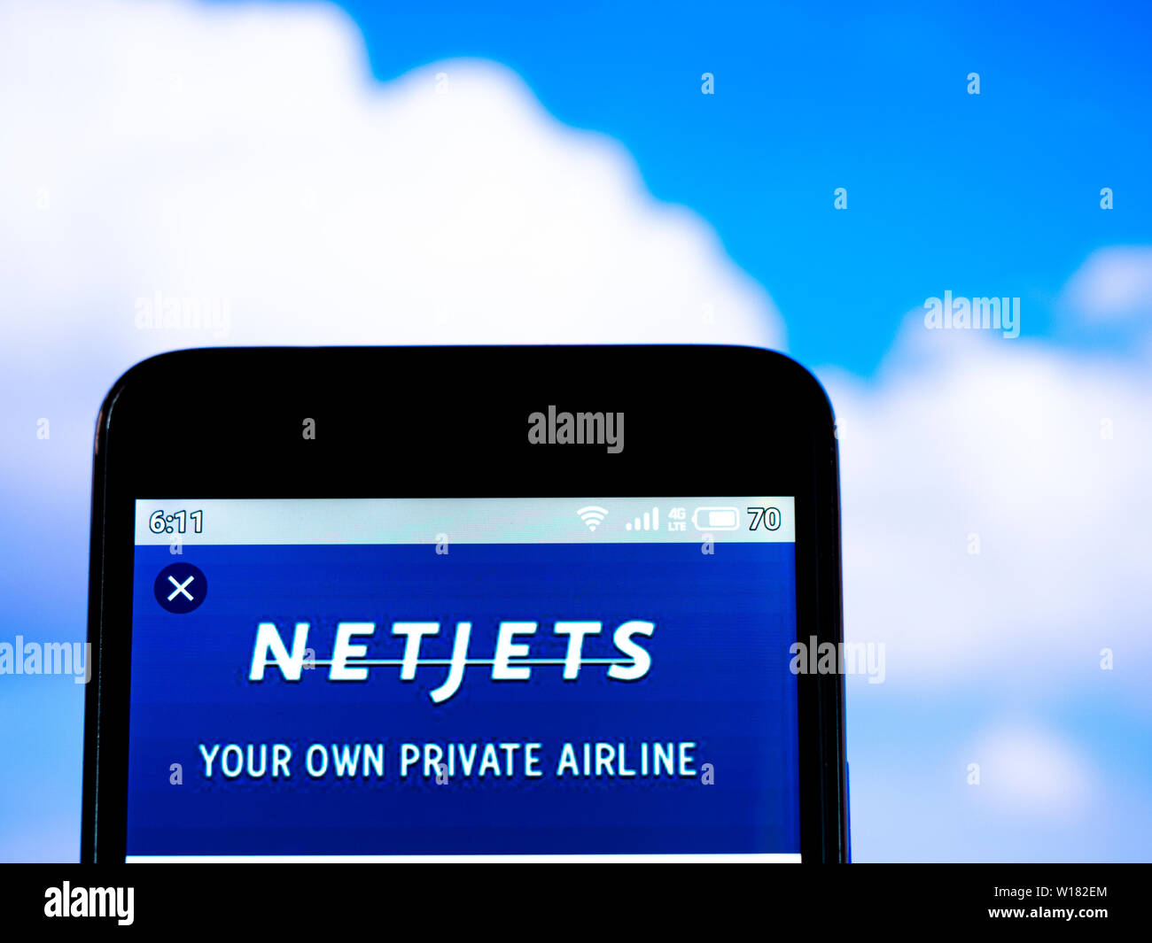 In this photo illustration the NetJets Inc. logo is seen displayed on a ...