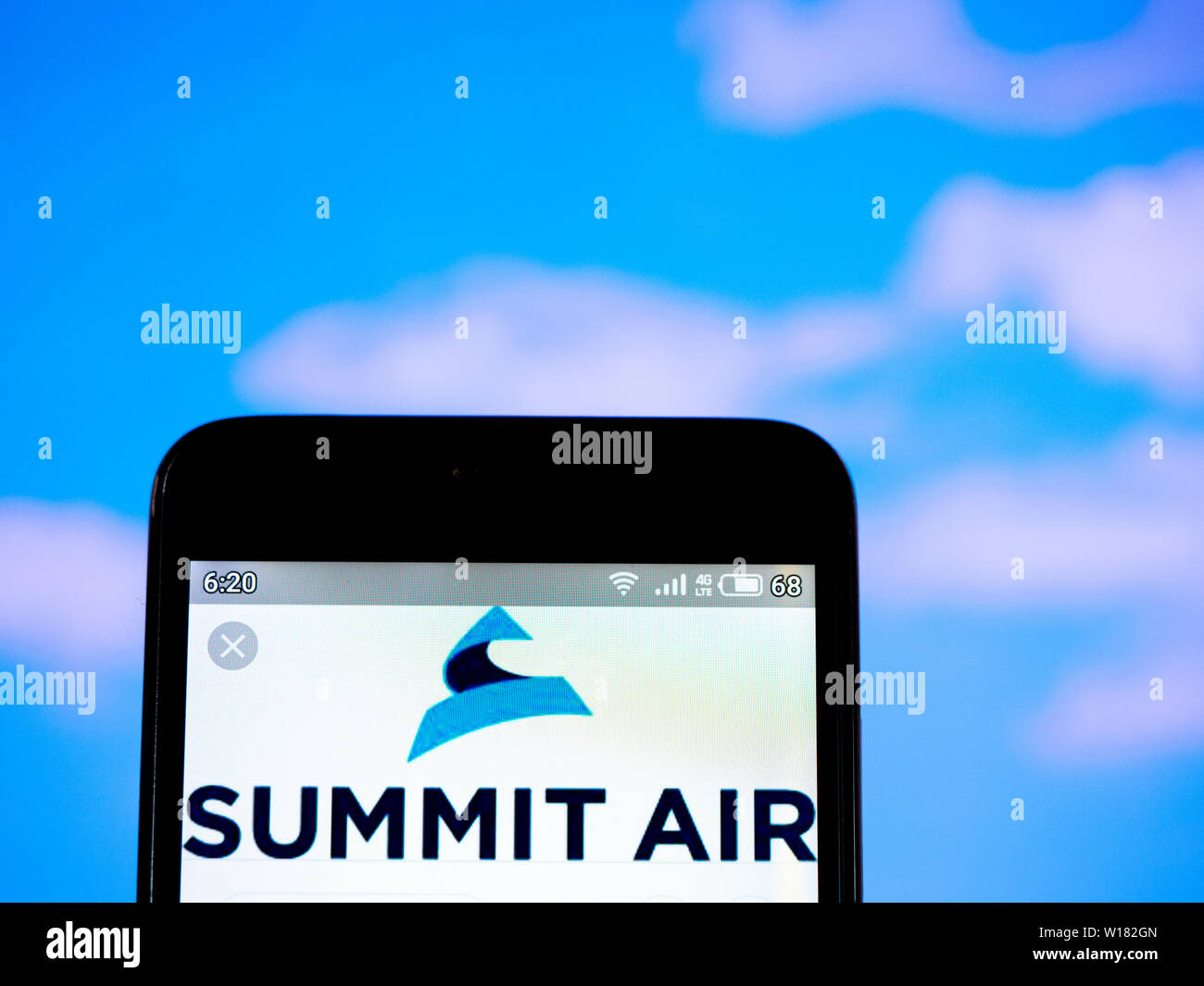 In this photo illustration the Summit Air logo is seen displayed on a smartphone Stock Photo - Alamy