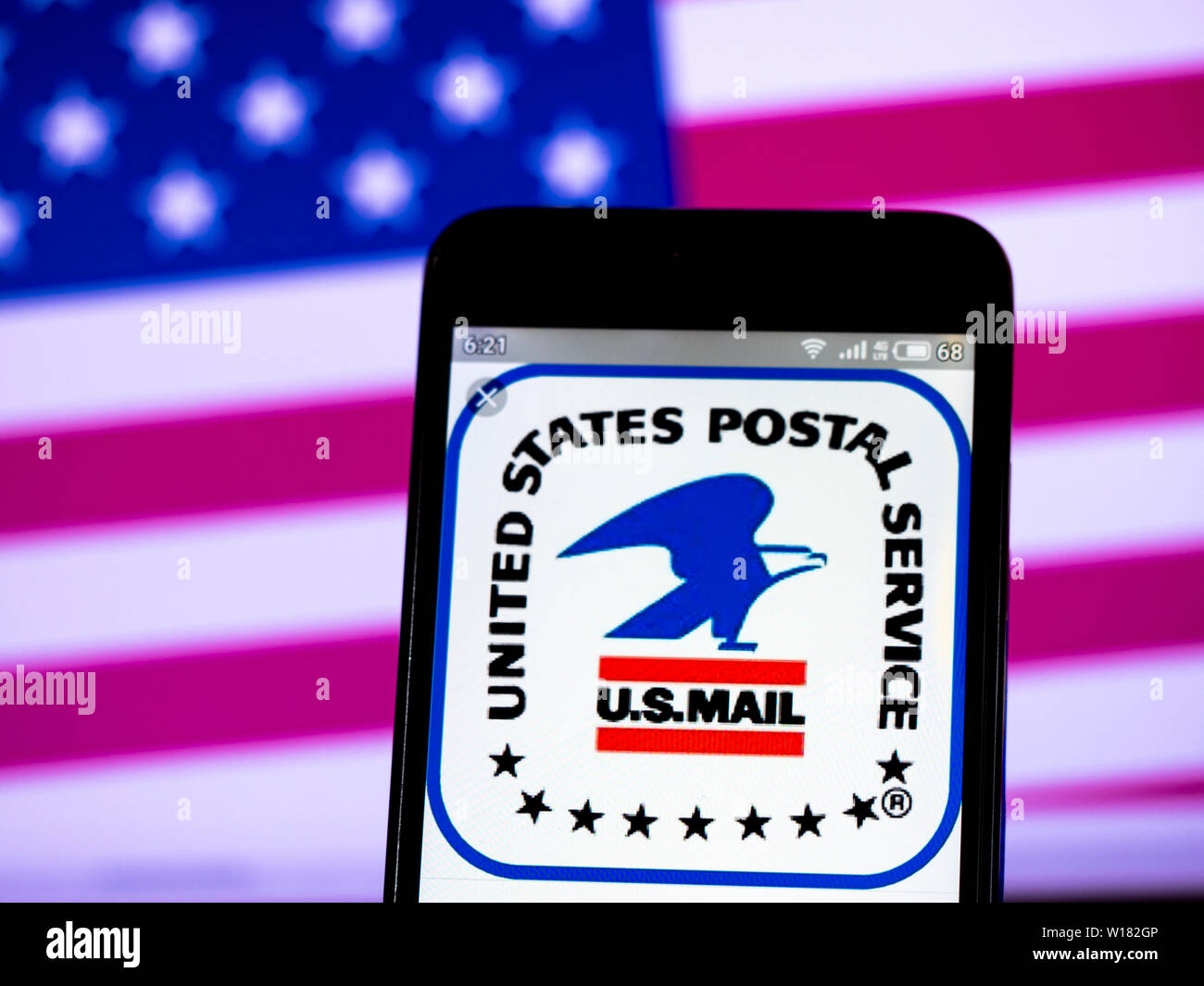 In this photo illustration the United States Postal Service logo is ...