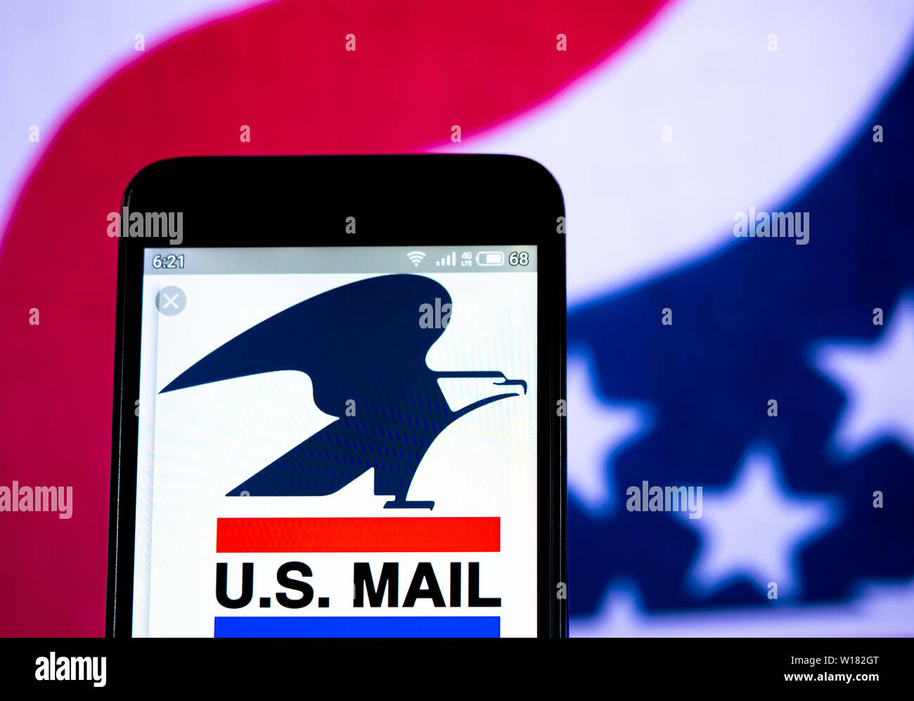 In this photo illustration the United States Postal Service logo is ...