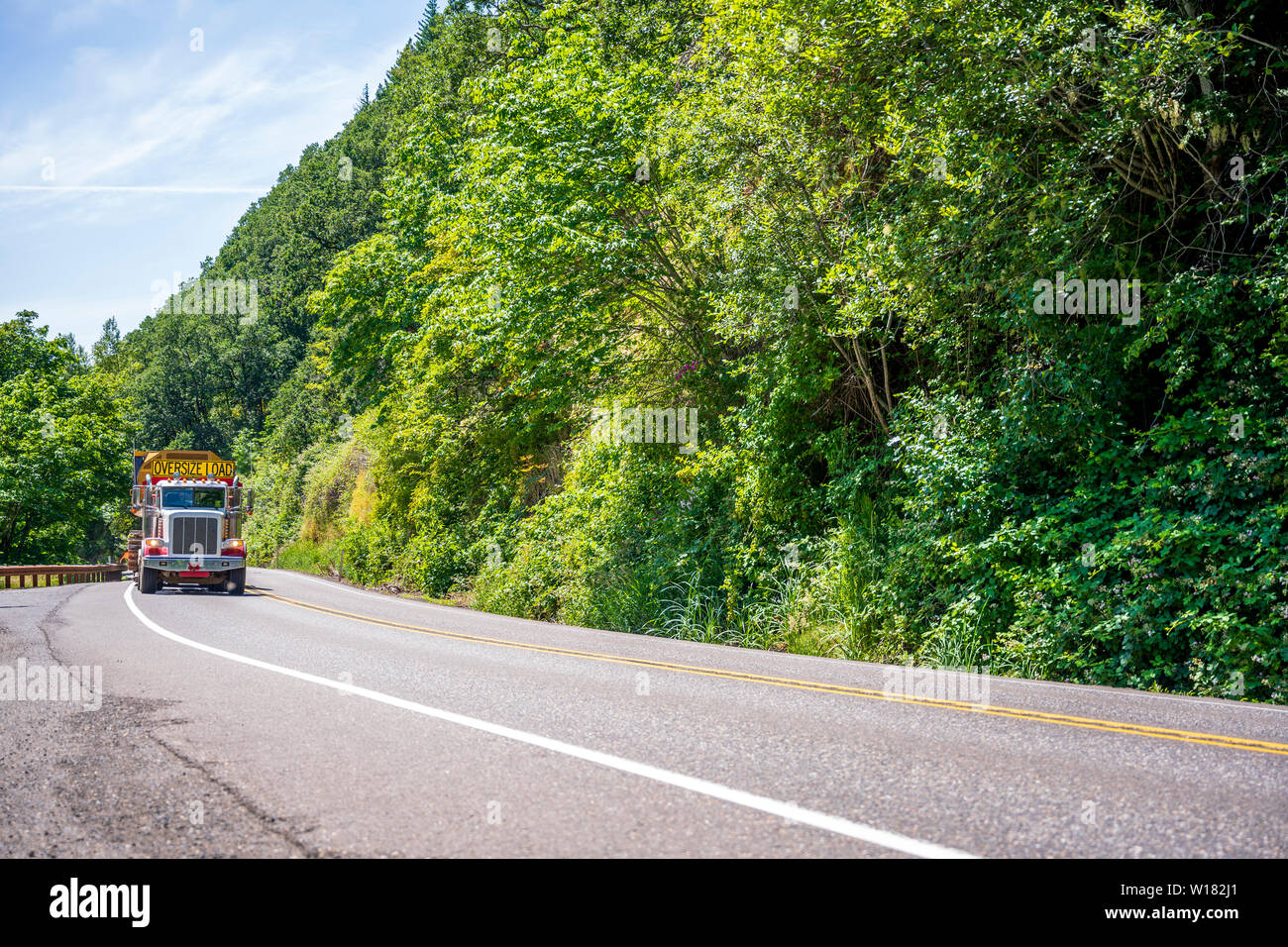 Big rig powerful heavy-duty semi truck tractor transporting oversized ...