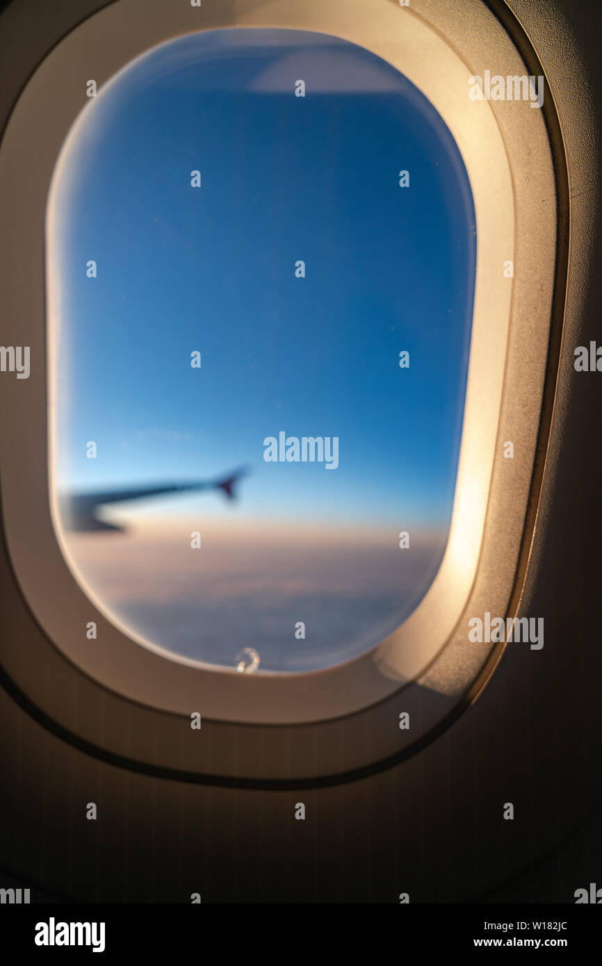 The window of the airplane. A view of porthole window on board an ...