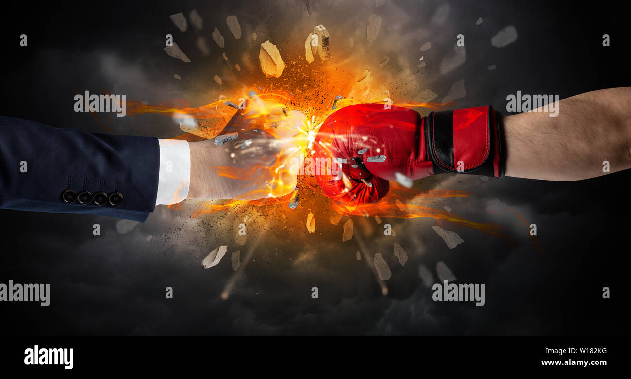 Two hands fighting and breaking a rock into small pieces Stock Photo ...