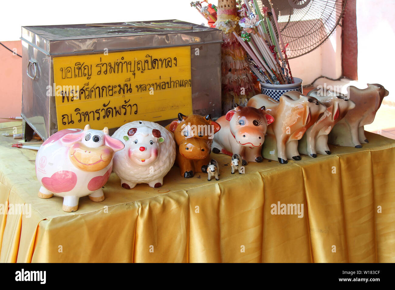 money boxes in a buddhist temple (Wat PhraThat Lampang Luang) in ...