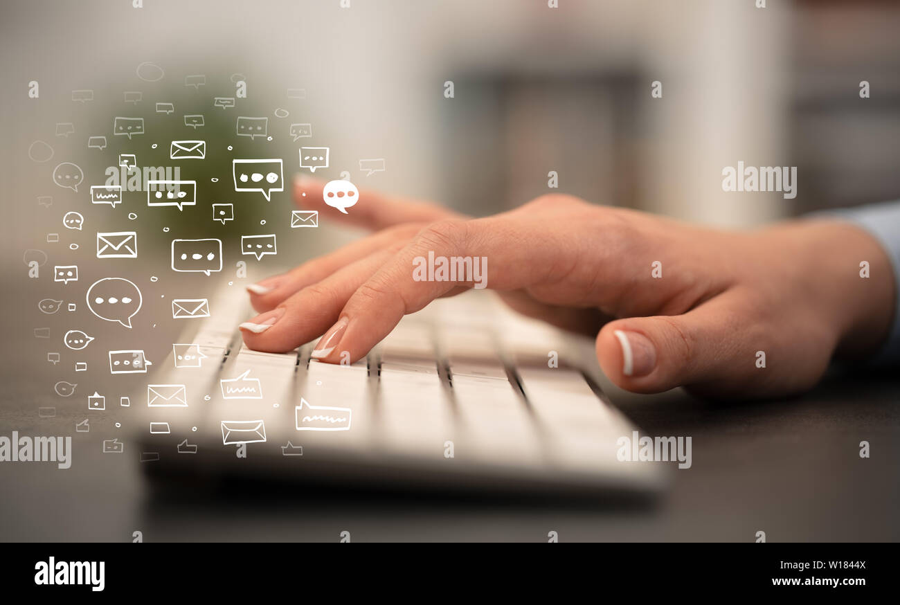 Business woman hand typing on keyboard with chat icons around Stock ...