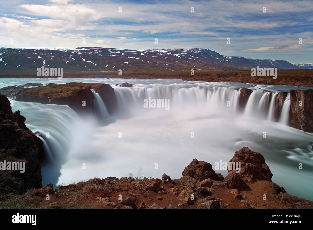 Godafoss waterfalls with mountain in Iceland Stock Photo - Alamy