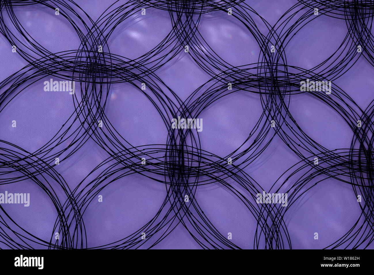 Abstract steel design tri-circle art design against wall. A nice ...