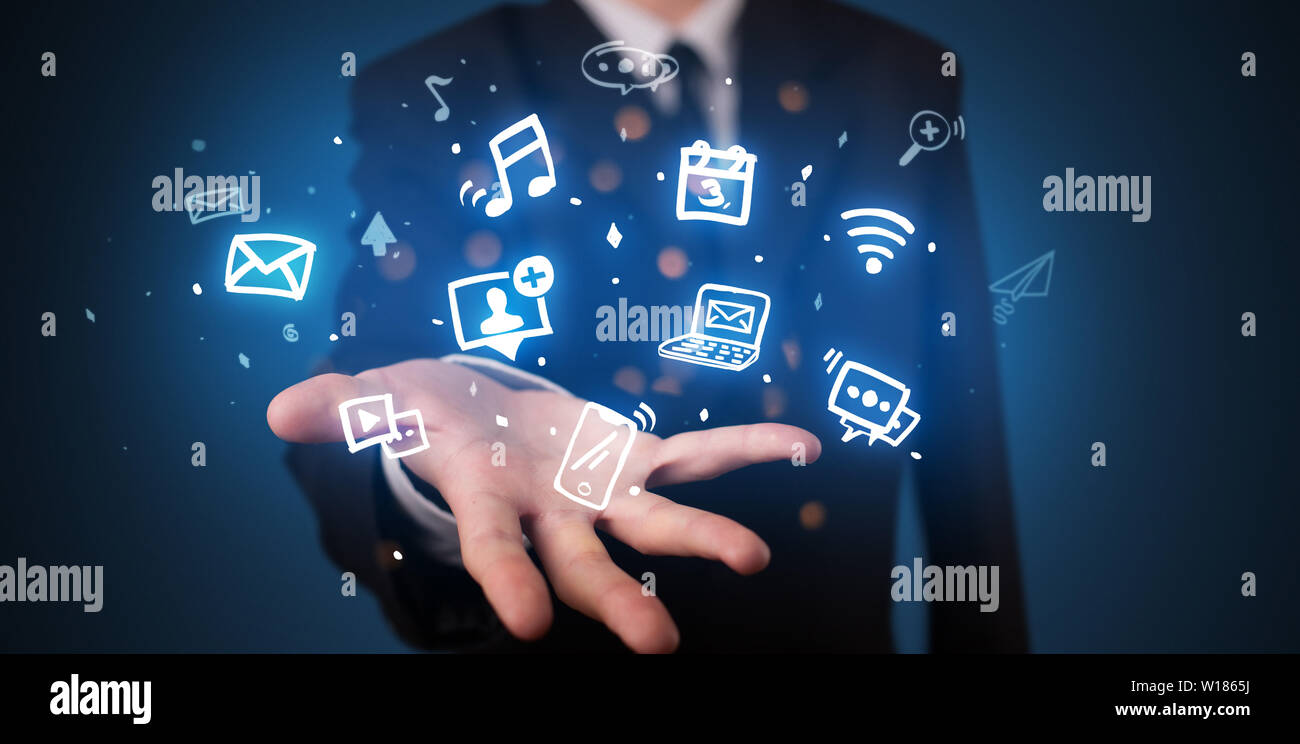 Hand holding application icons and symbols in her hand Stock Photo - Alamy