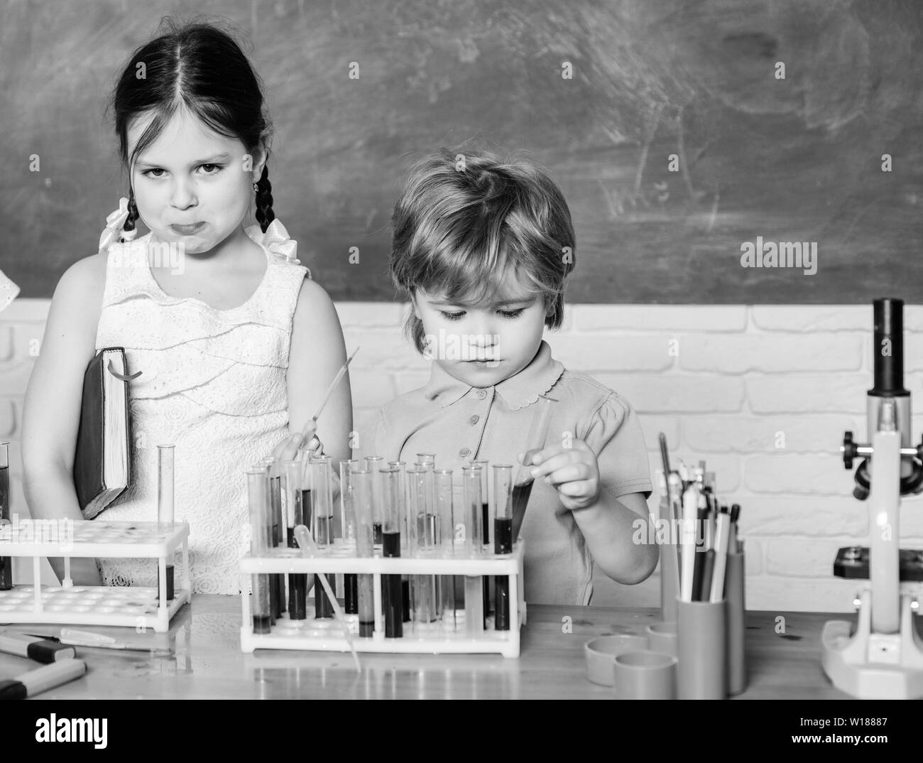 students doing science experiments with microscope in lab. back to ...