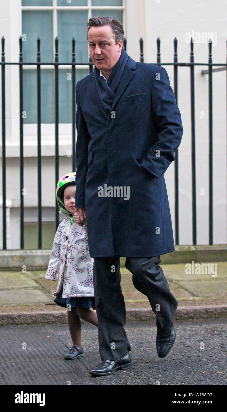 Prime Minister David Cameron on Downing Street walking his daughter ...