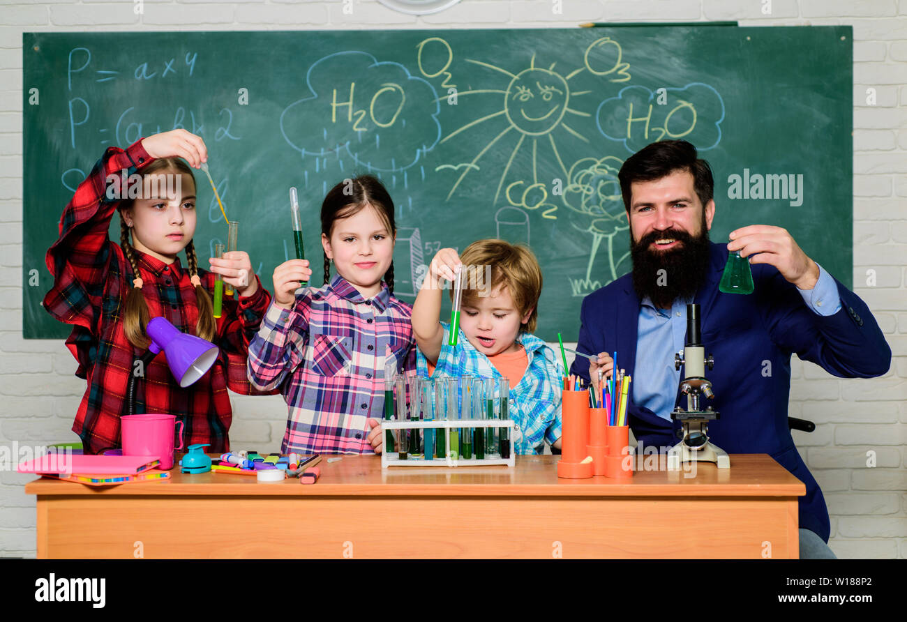 Scientists at work. students doing science experiments with microscope ...