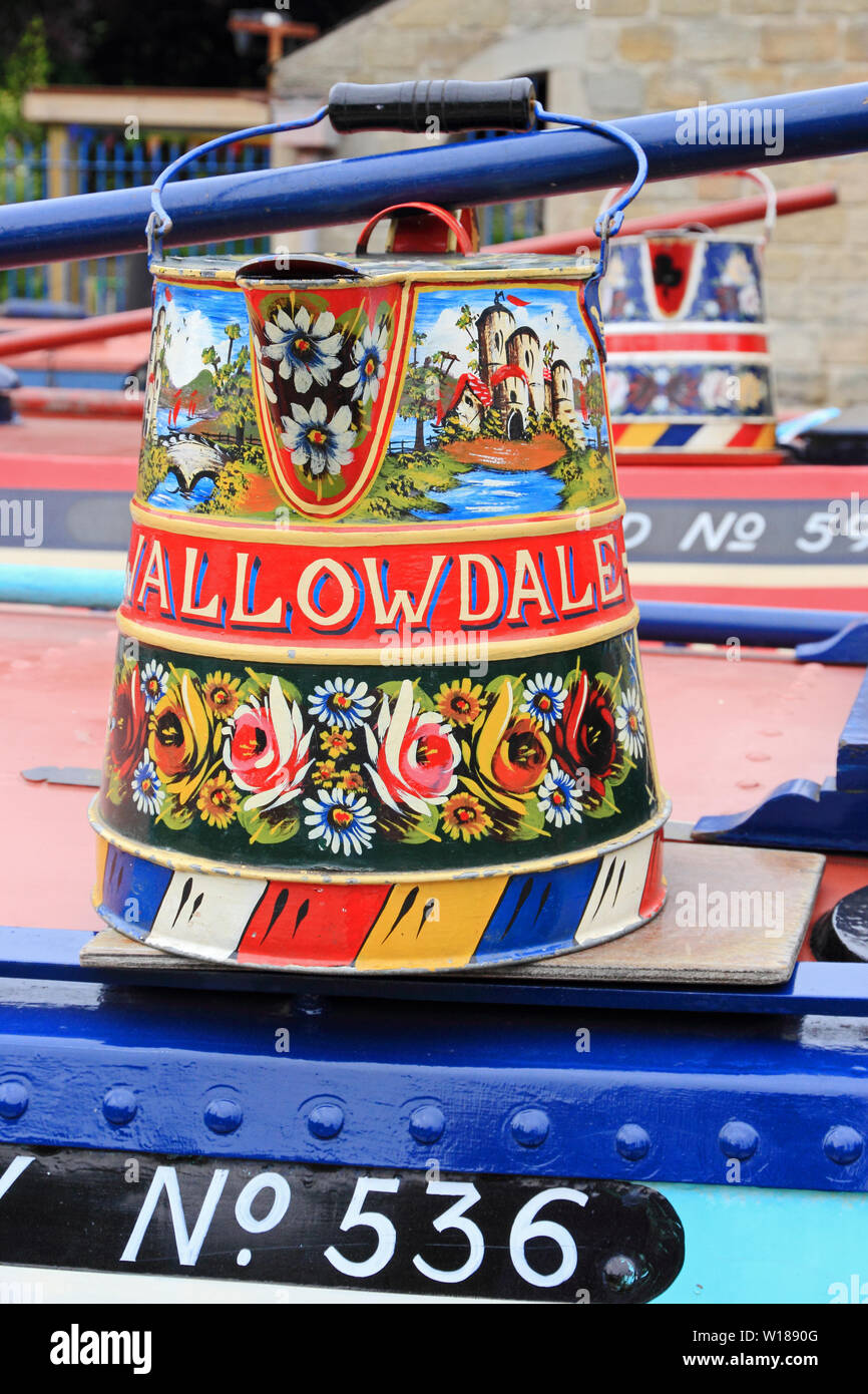 Brightly painted, canal style, water pails on top of traditional narrow ...