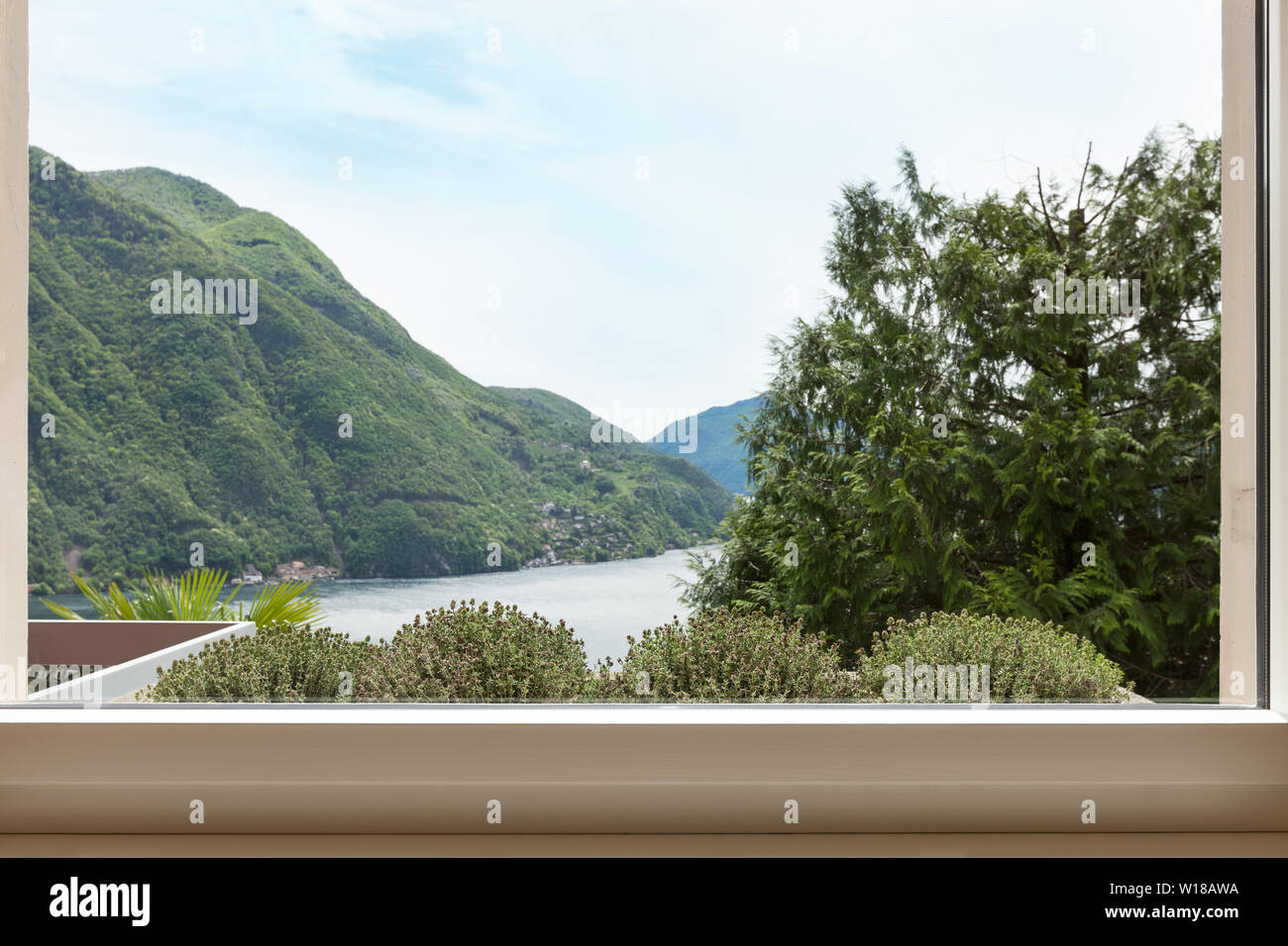 Interior, mountain landscape seen from a window of apartment Stock ...