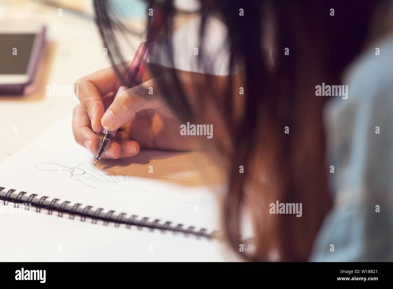 Female graphic designers writing hi-res stock photography and images ...