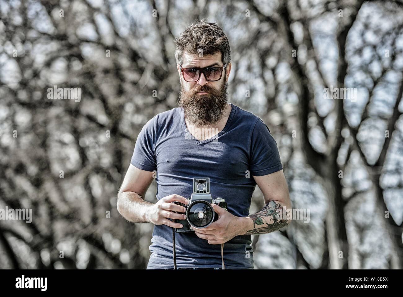 Photographer hold vintage camera. Modern blogger. Content creator. Man ...