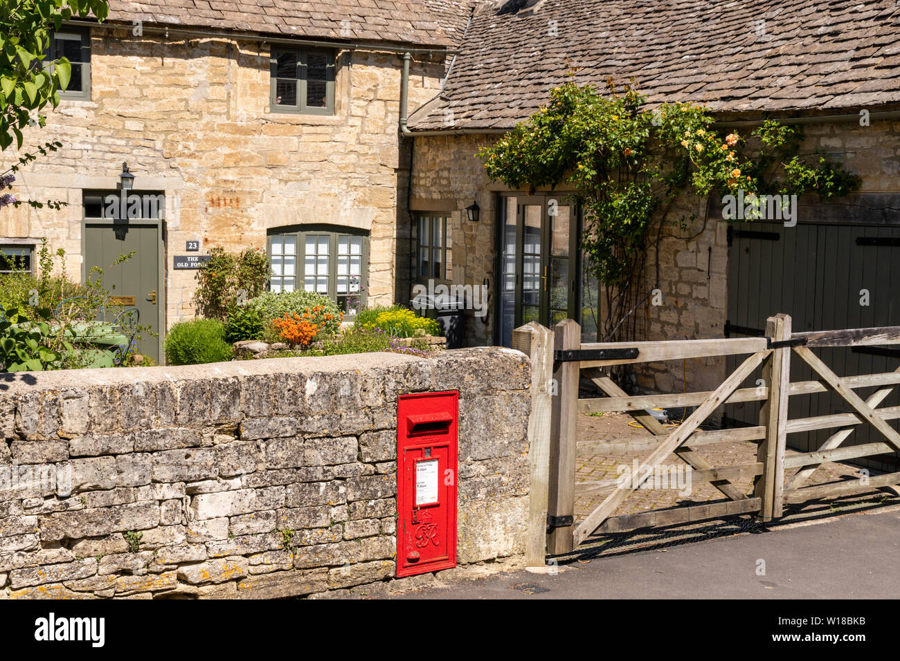 A bright red post box let into the wall outside The Old Forge in the ...
