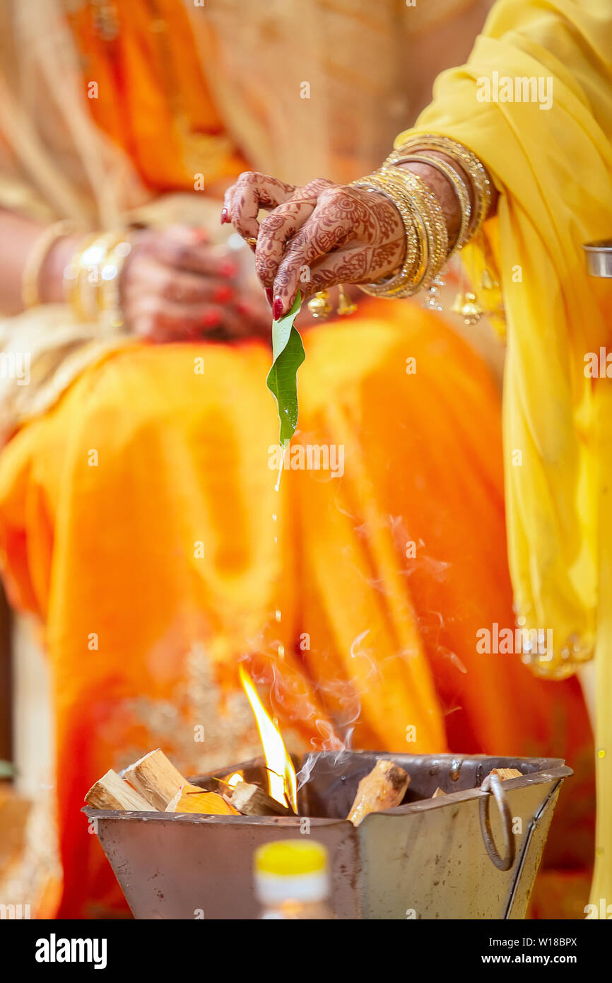 Performing religious ceremony on wedding eve Stock Photo - Alamy