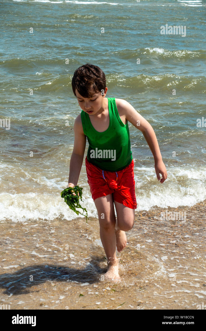 Children paddle in sea fun hi-res stock photography and images - Alamy