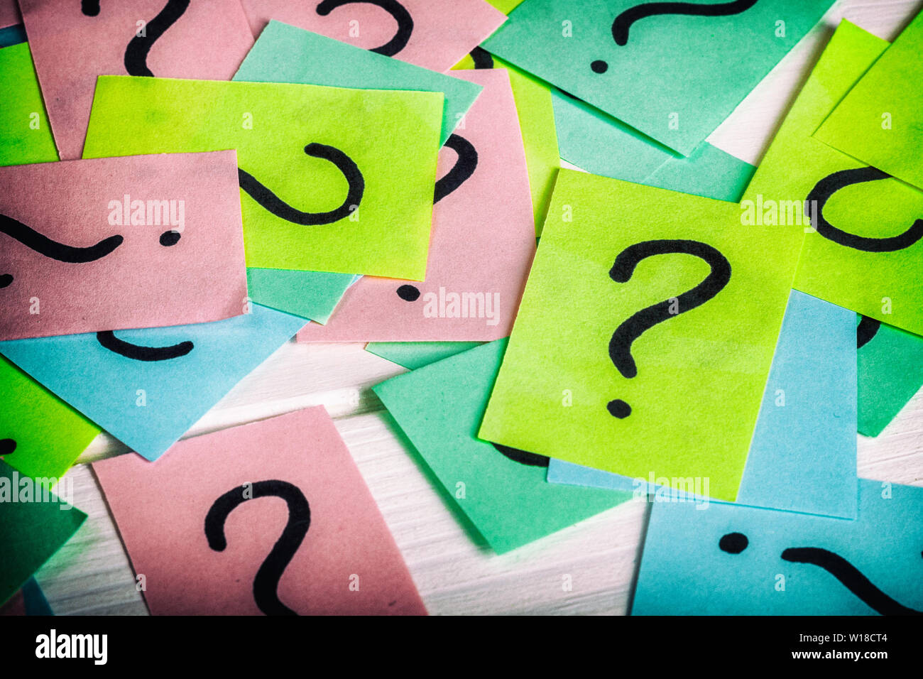 Just a lot of question marks on colored papers Stock Photo - Alamy
