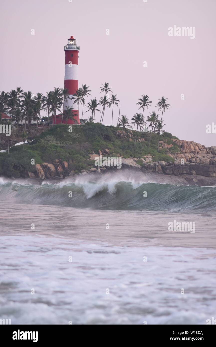 Waves & Light house at Koval beach, Kerala, India Stock Photo - Alamy