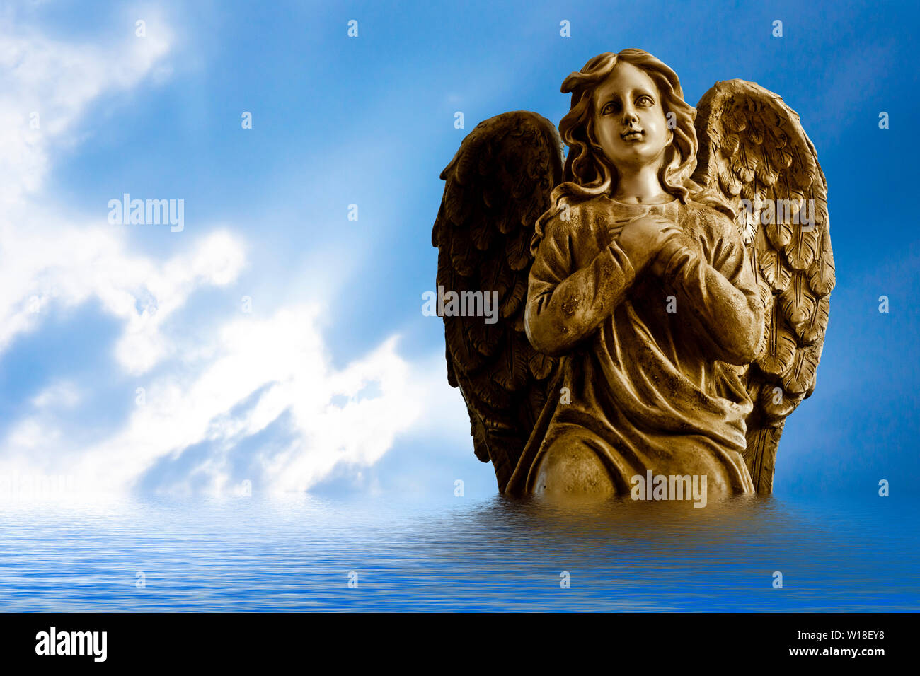 statue of an angel emerging from water Stock Photo - Alamy