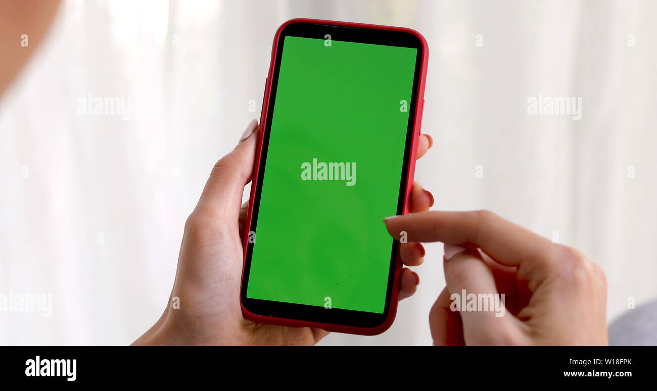Woman holding greenscreen smartphone hi-res stock photography and ...