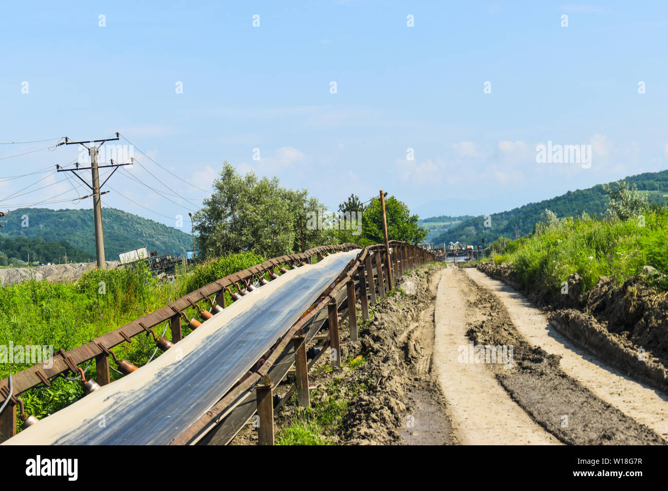 Coal transportation line for processing. Belt conveyor inside the open ...