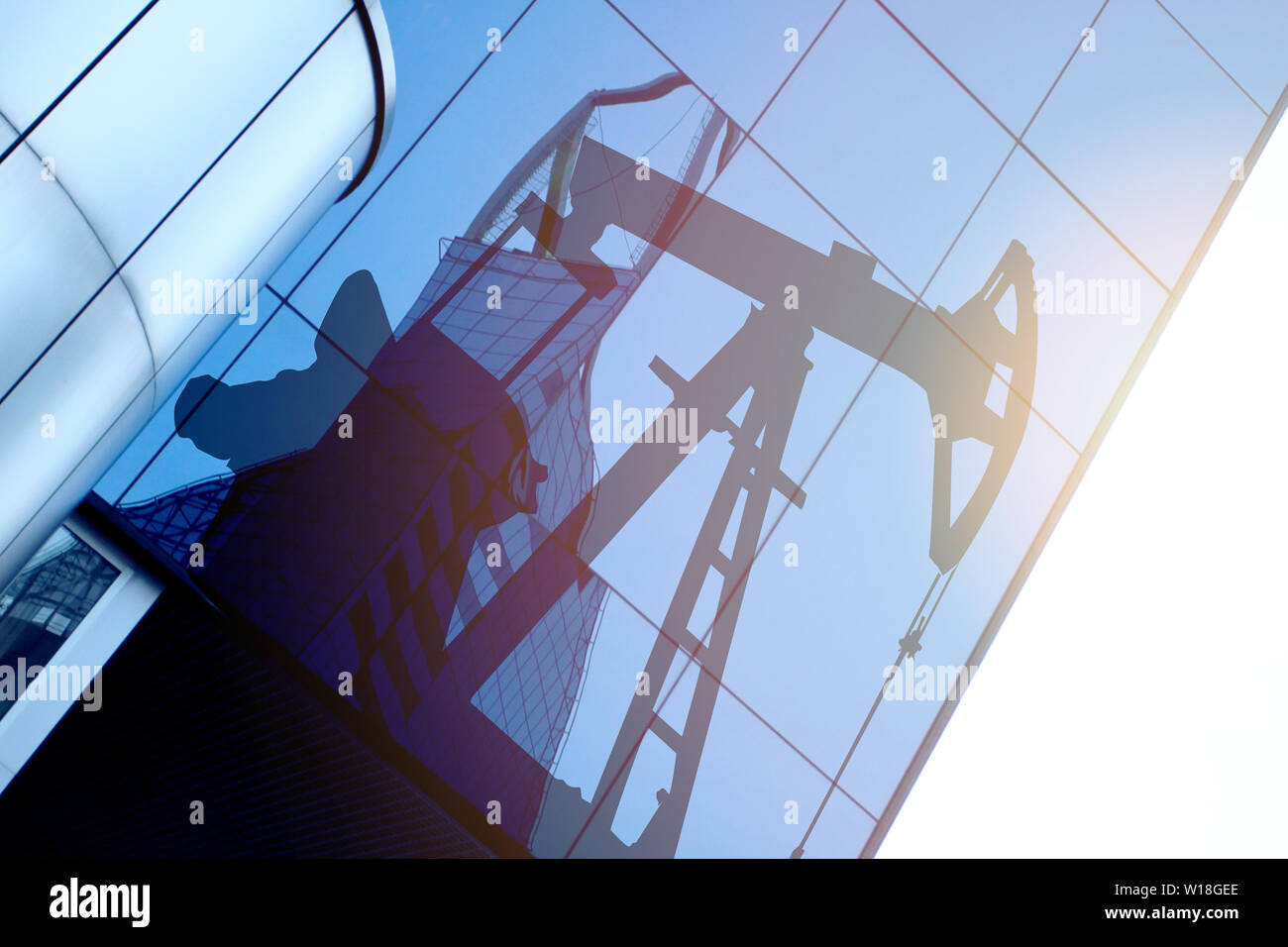 Modern office building with sign oil derrick on a background of the ...