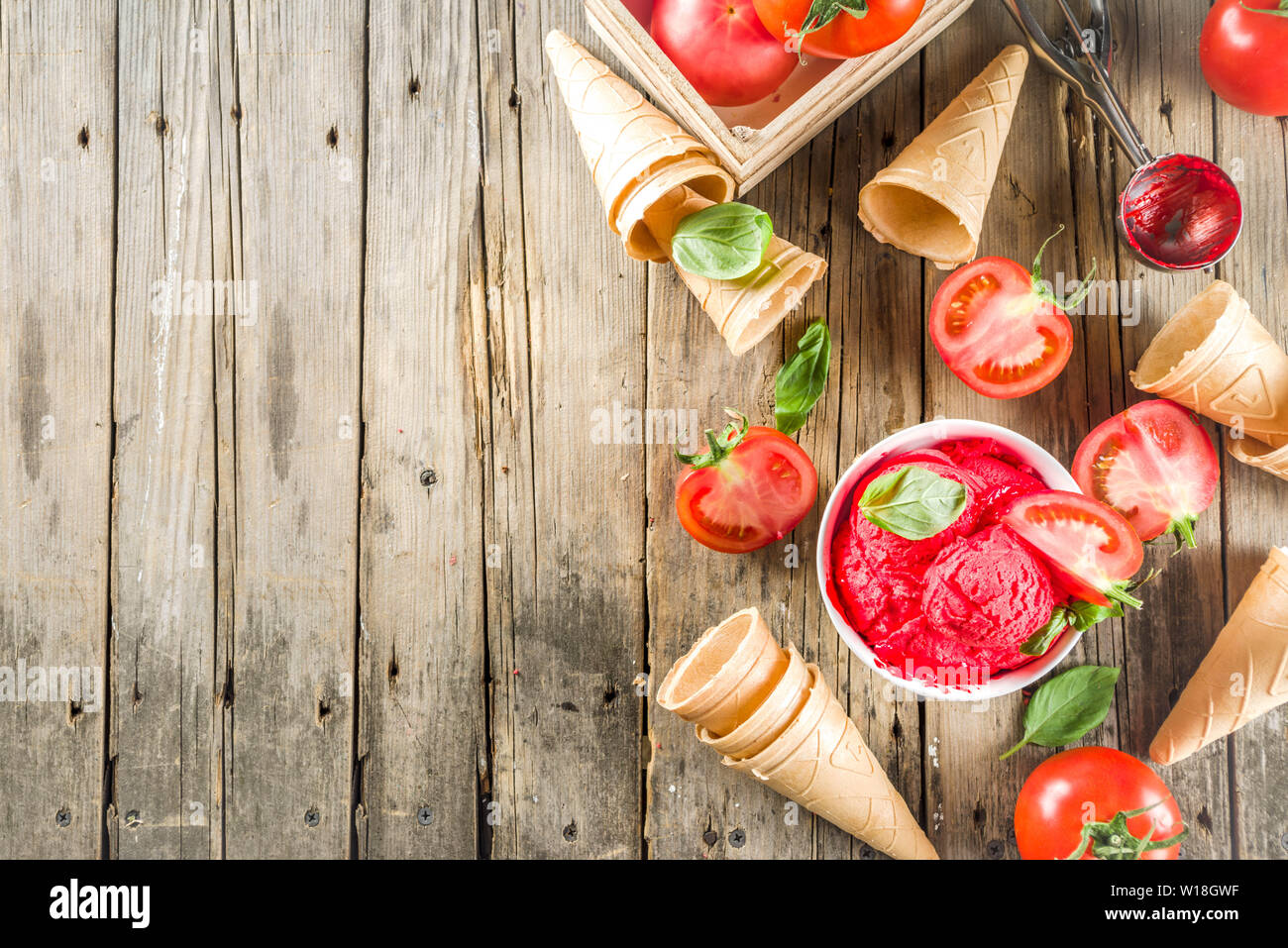 Vegetable gelato. Tomato ice cream with fresh tomatoes and basil and ...