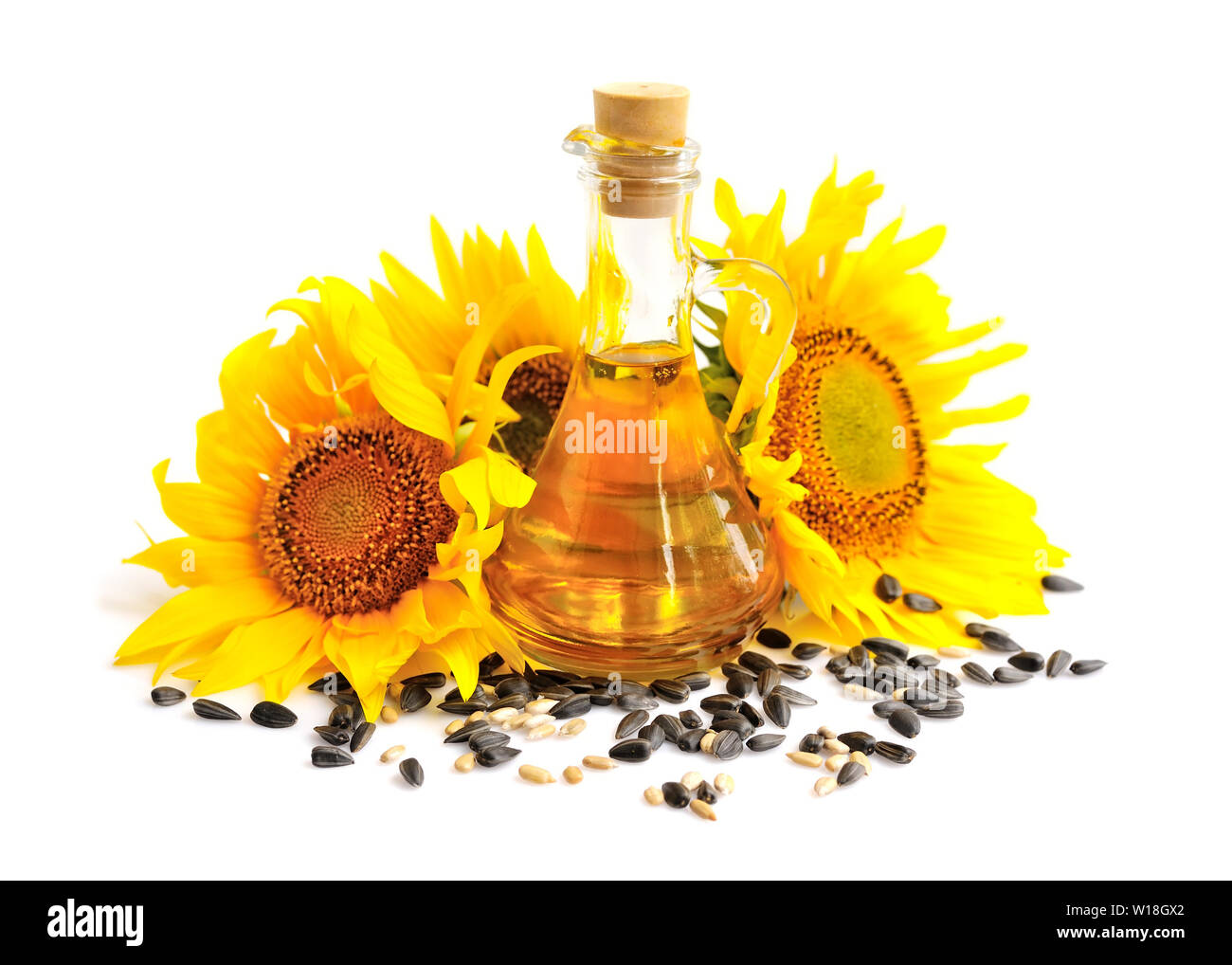 Sunflower oil with flowers and by seed on white background Stock Photo ...