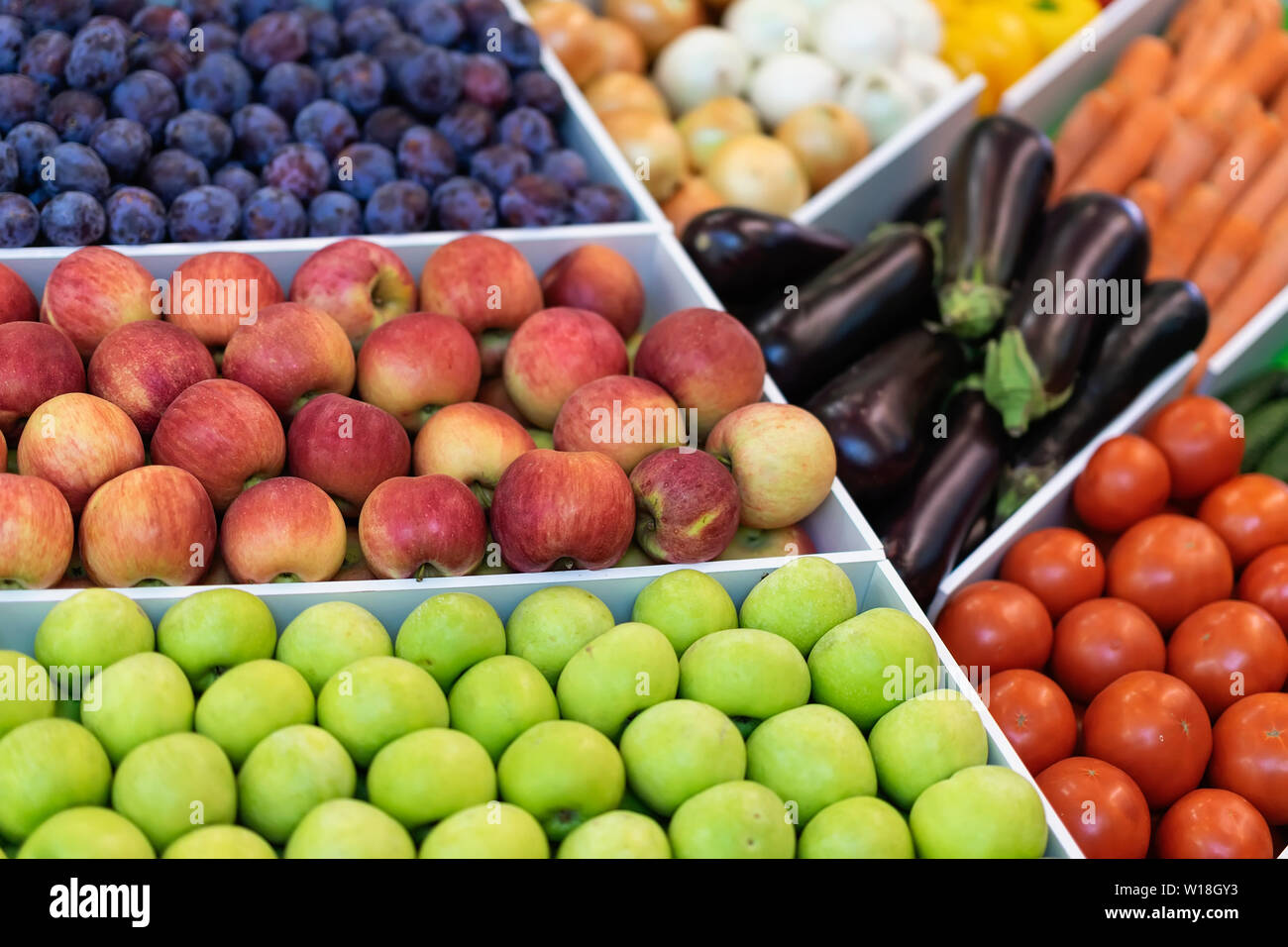 Assorted fruits and vegetables in a tray on the market Stock Photo - Alamy