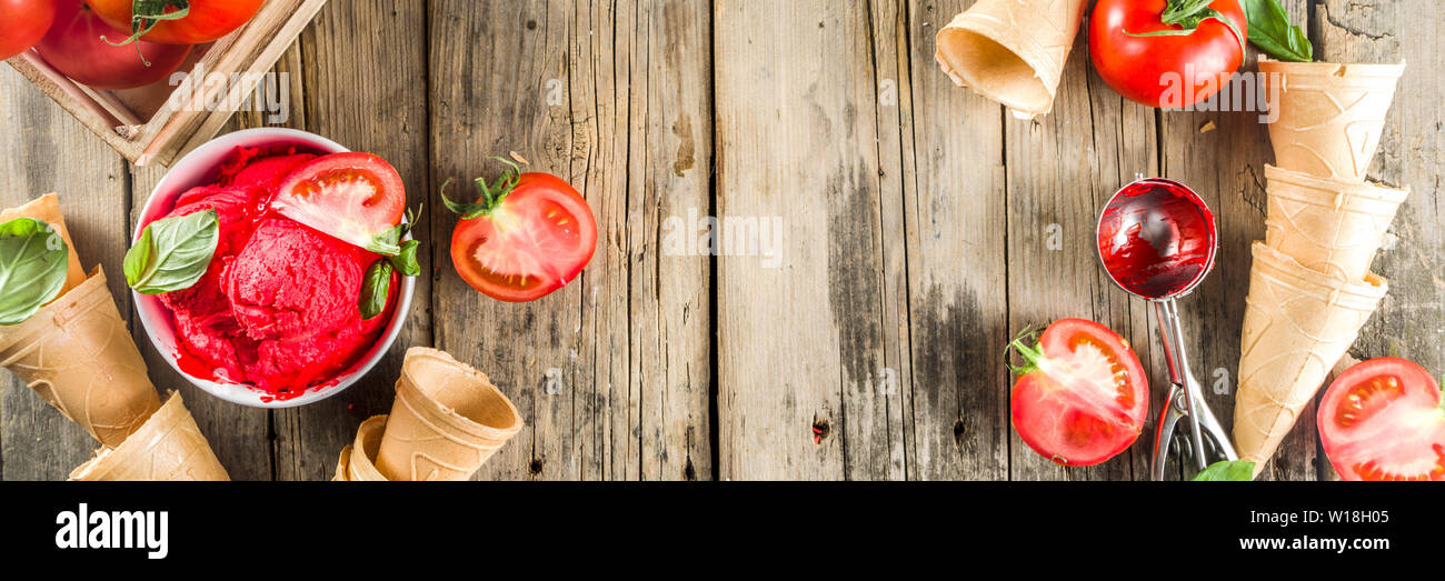 Vegetable gelato. Tomato ice cream with fresh tomatoes and basil and ...